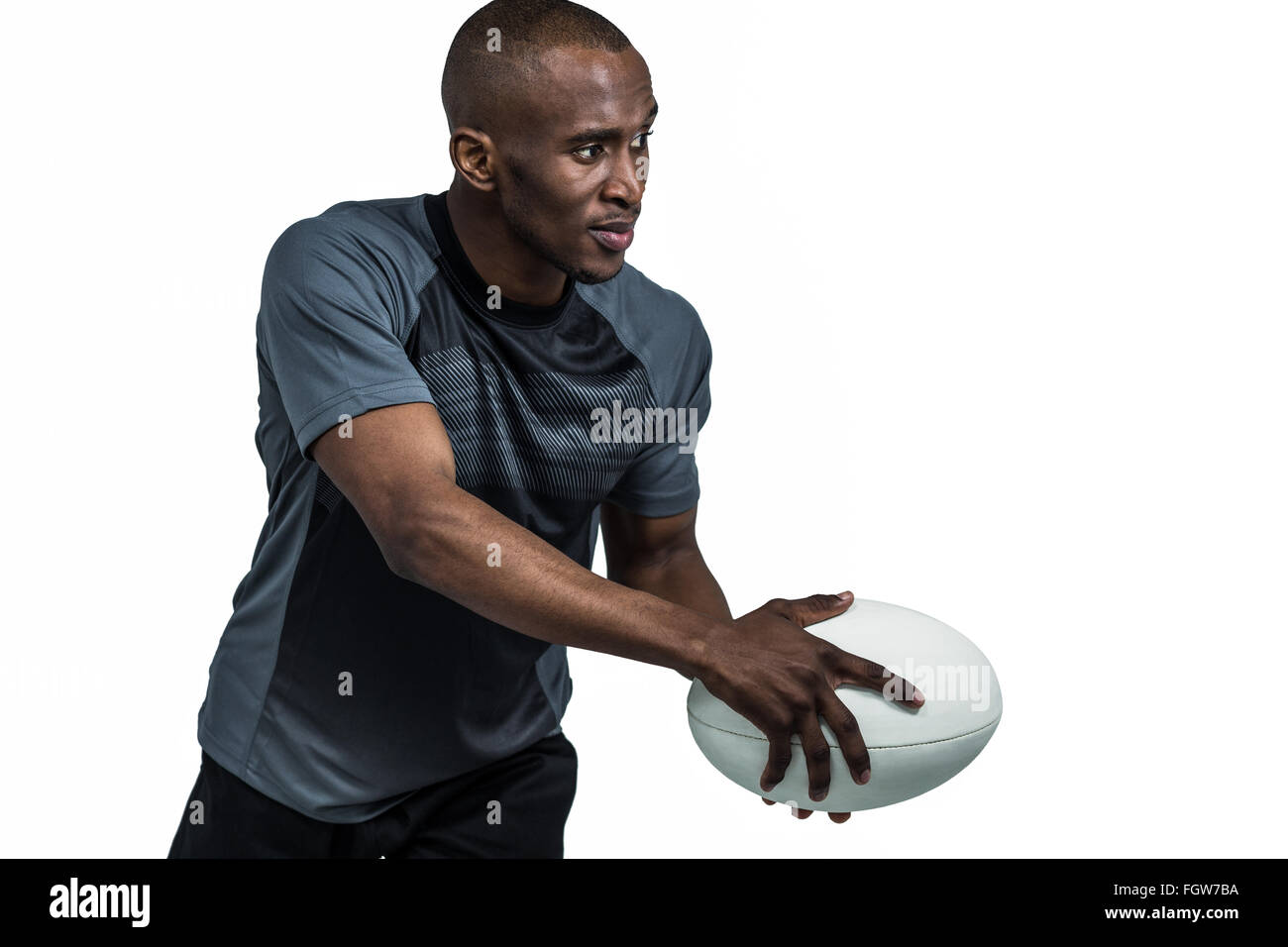 Confident sportsman in position to throw rugby ball Stock Photo - Alamy