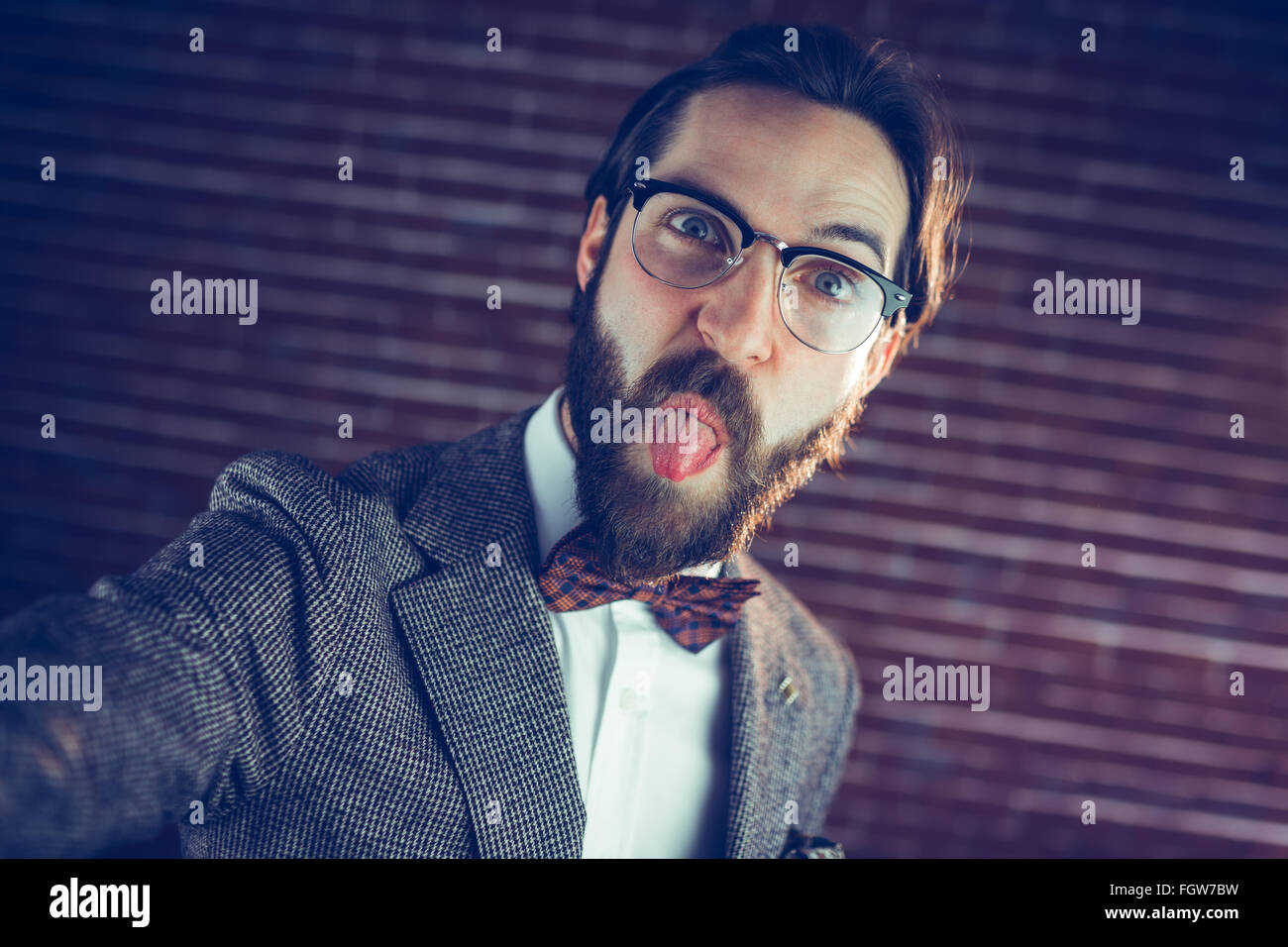 Mischievous young smiling tease hi-res stock photography and images - Alamy