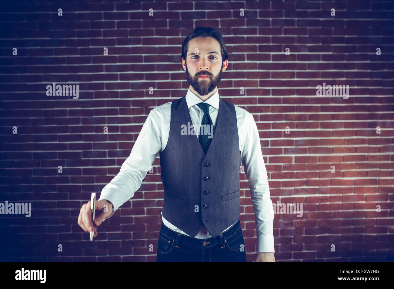 Portrait of man holding pen Stock Photo - Alamy