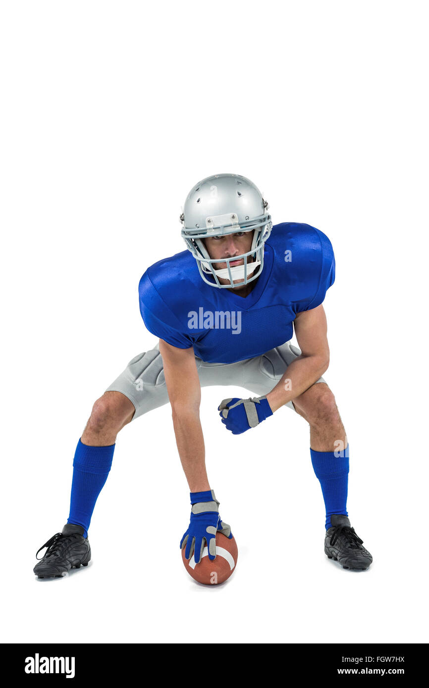American football player in attack stance Stock Photo - Alamy