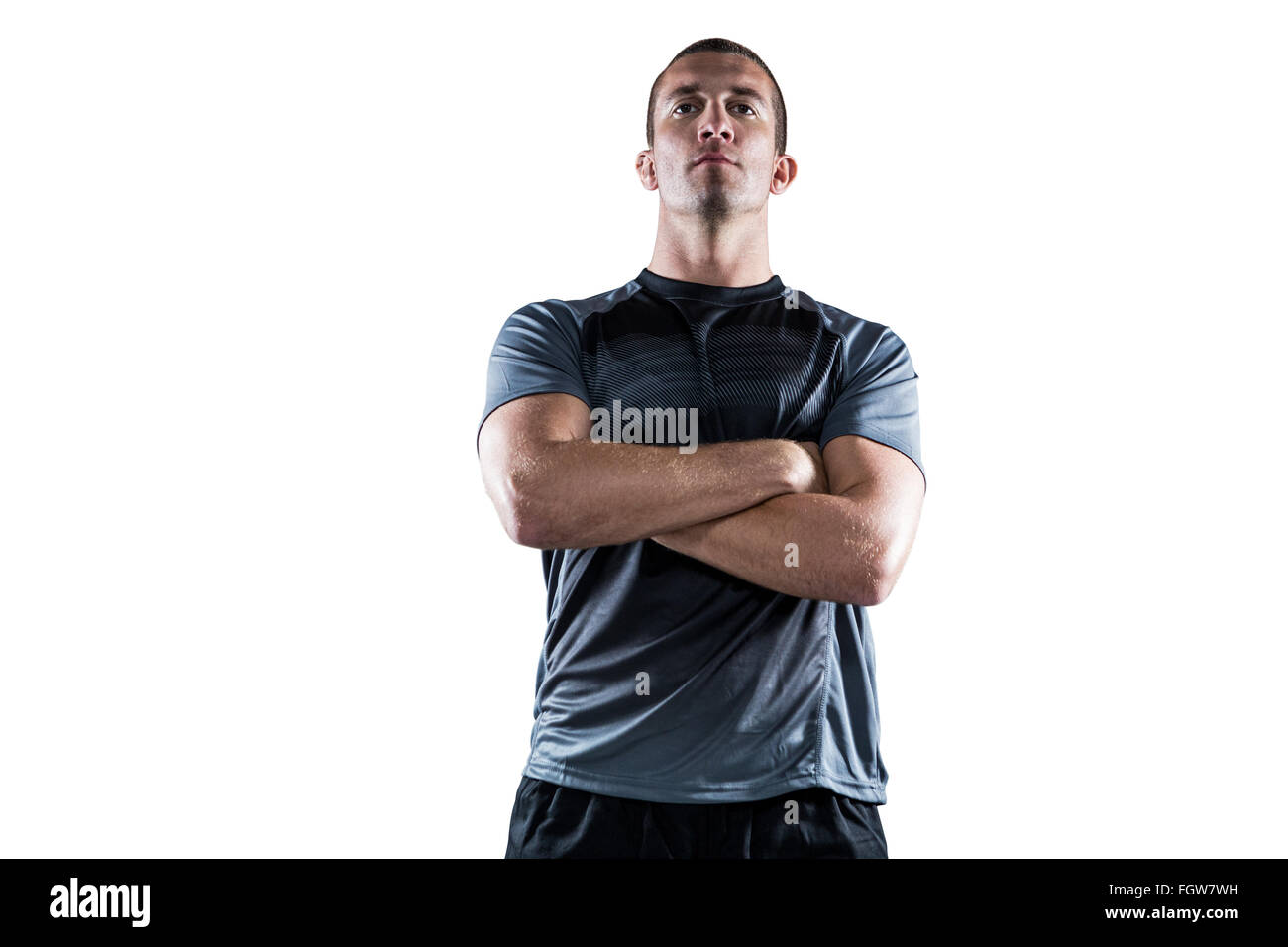 Confident rugby player with arms crossed Stock Photo - Alamy