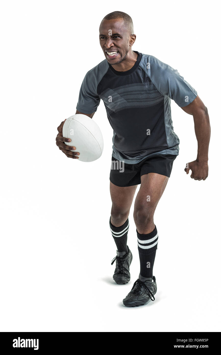 Sportsman running while playing rugby Stock Photo - Alamy