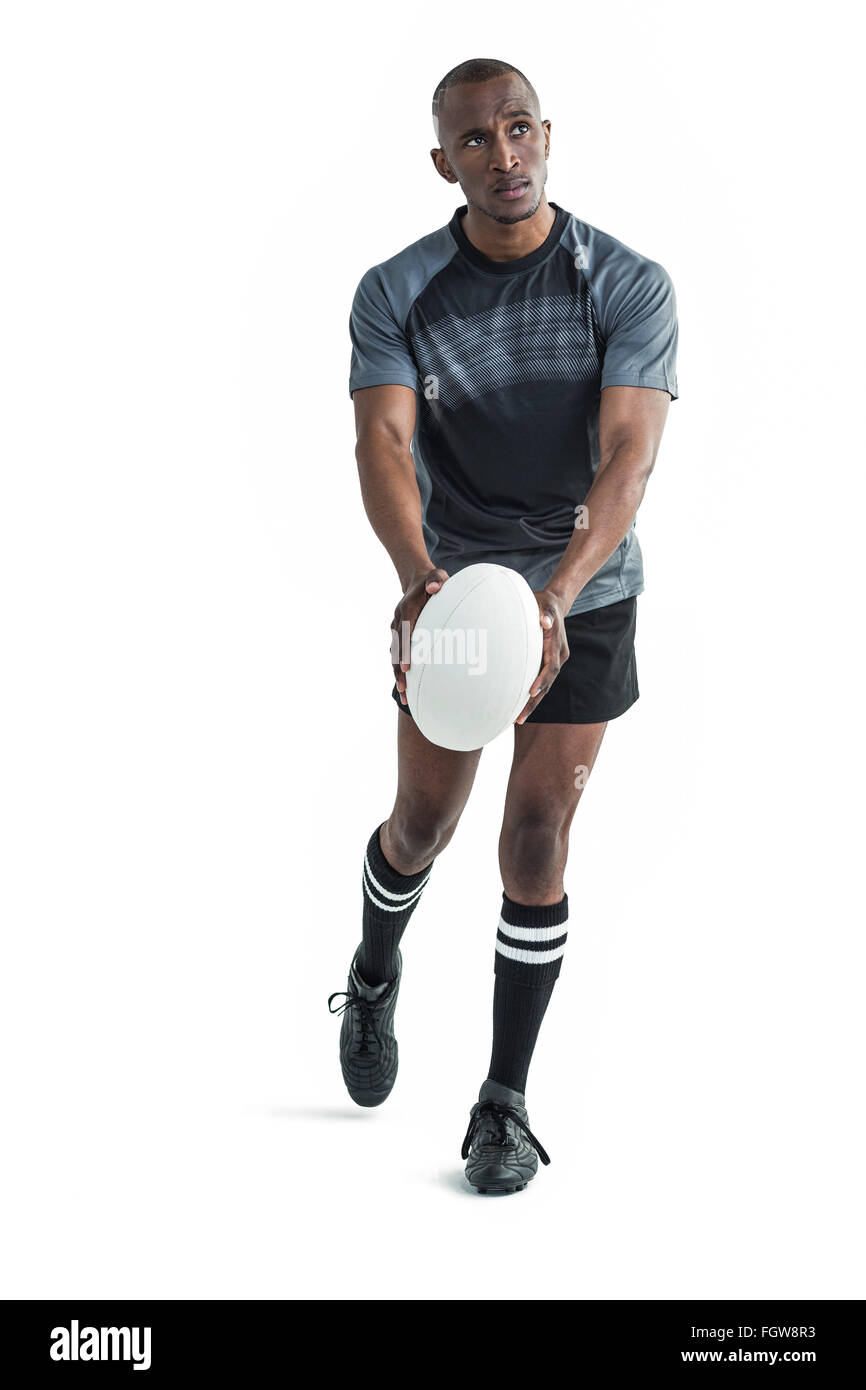 Athlete throwing rugby ball Stock Photo - Alamy