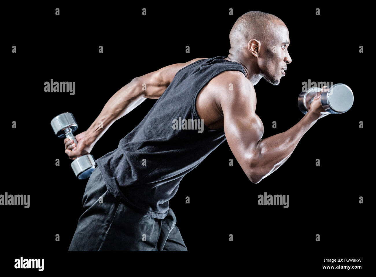 Muscular man running while holding dumbbell Stock Photo - Alamy