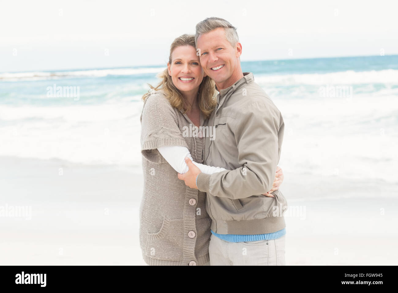 Smiling man holding his partner Stock Photo - Alamy