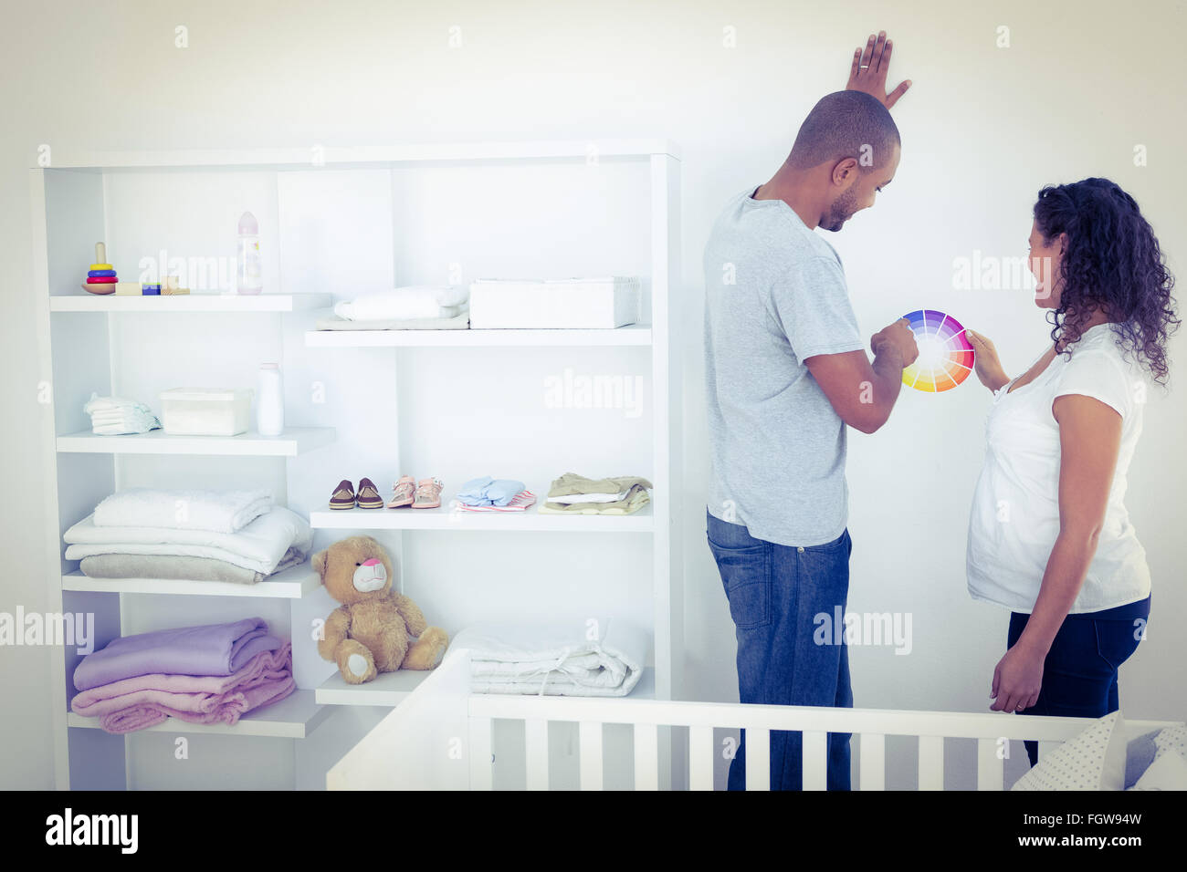 Couple choosing color from chart Stock Photo - Alamy
