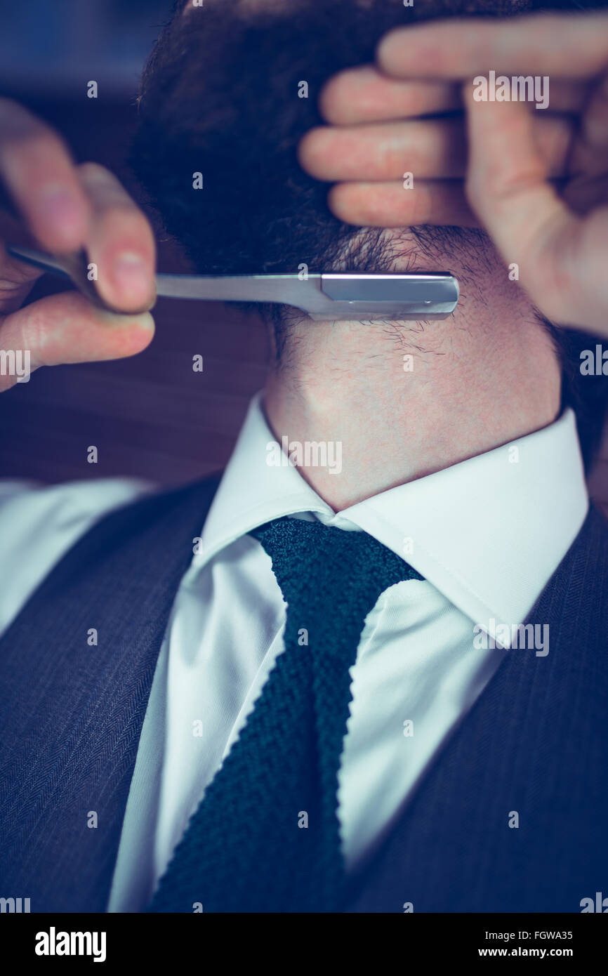 Midsection of man shaving beard Stock Photo - Alamy