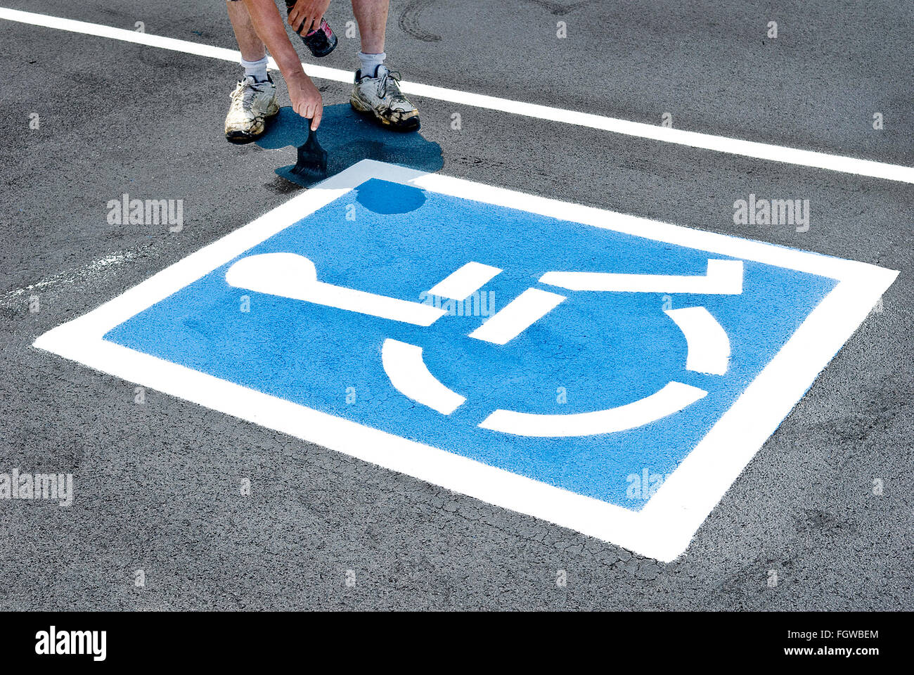 Painting Handicapped Parking Sign Stock Photo - Alamy