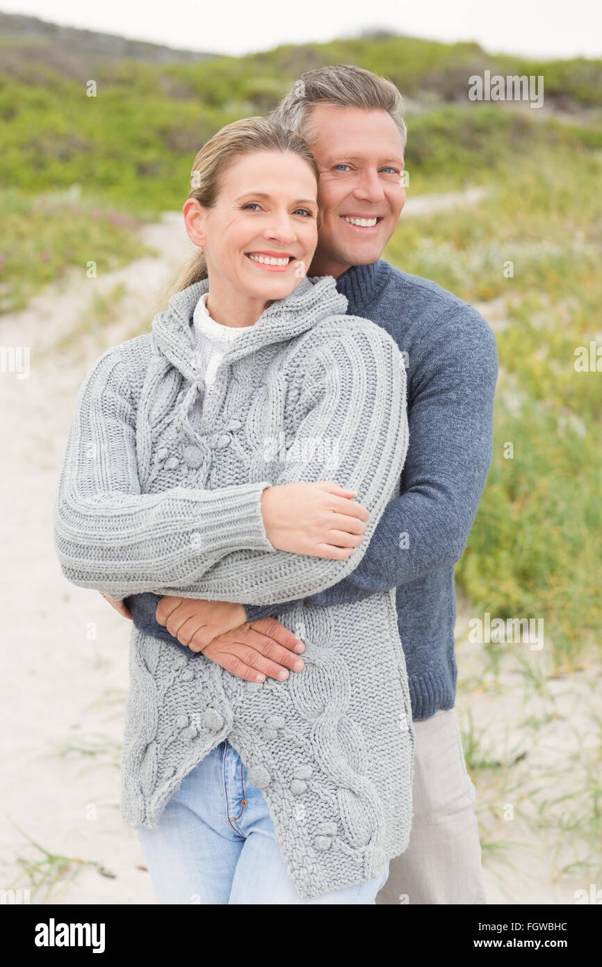 Smiling couple holding each other Stock Photo - Alamy