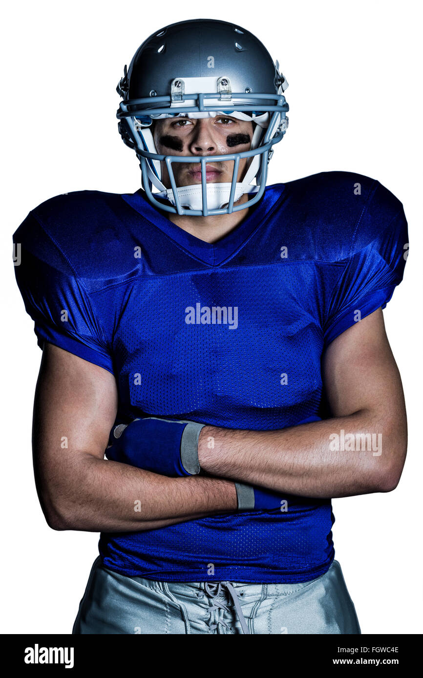 Portrait of determined American football player with arms crossed Stock ...