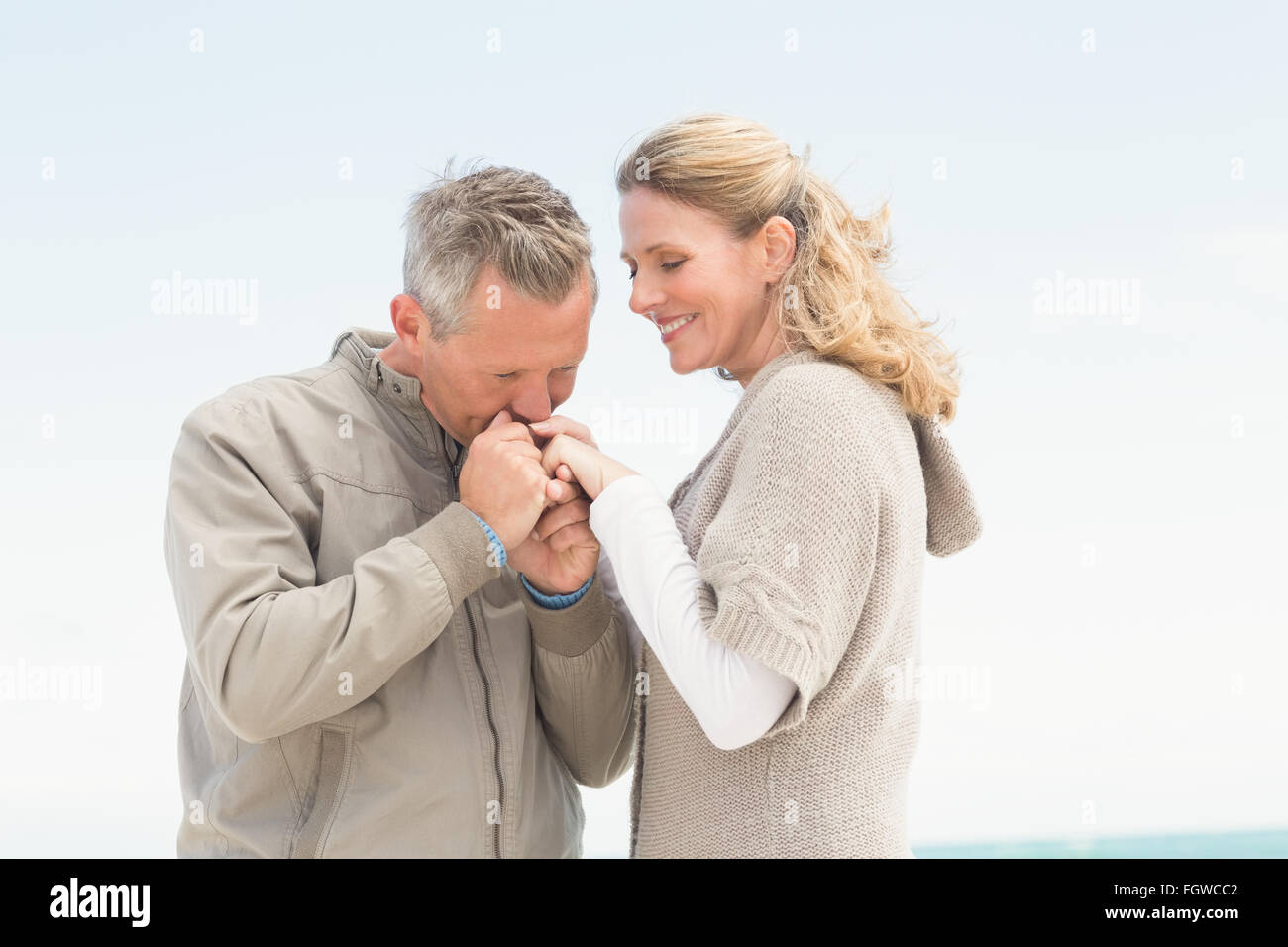 Happy couple holding each other Stock Photo - Alamy