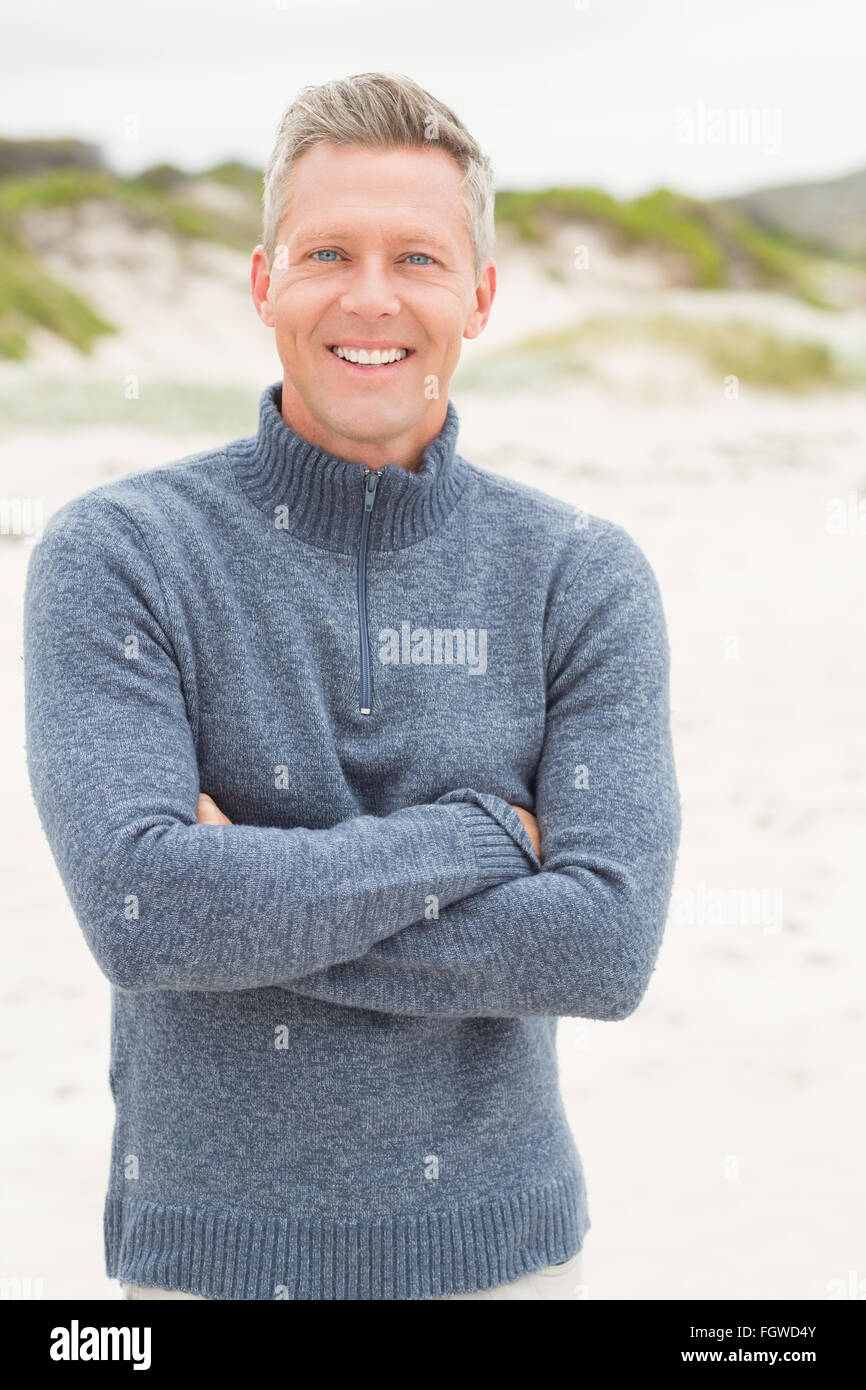 Smiling man with crossed arms Stock Photo - Alamy