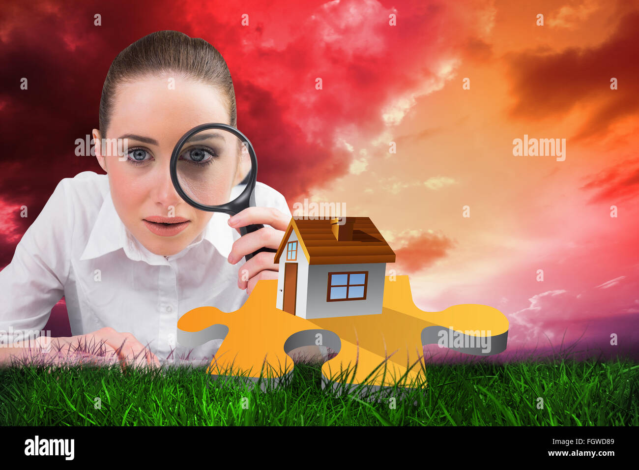 Composite image of businesswoman typing and looking through magnifying ...
