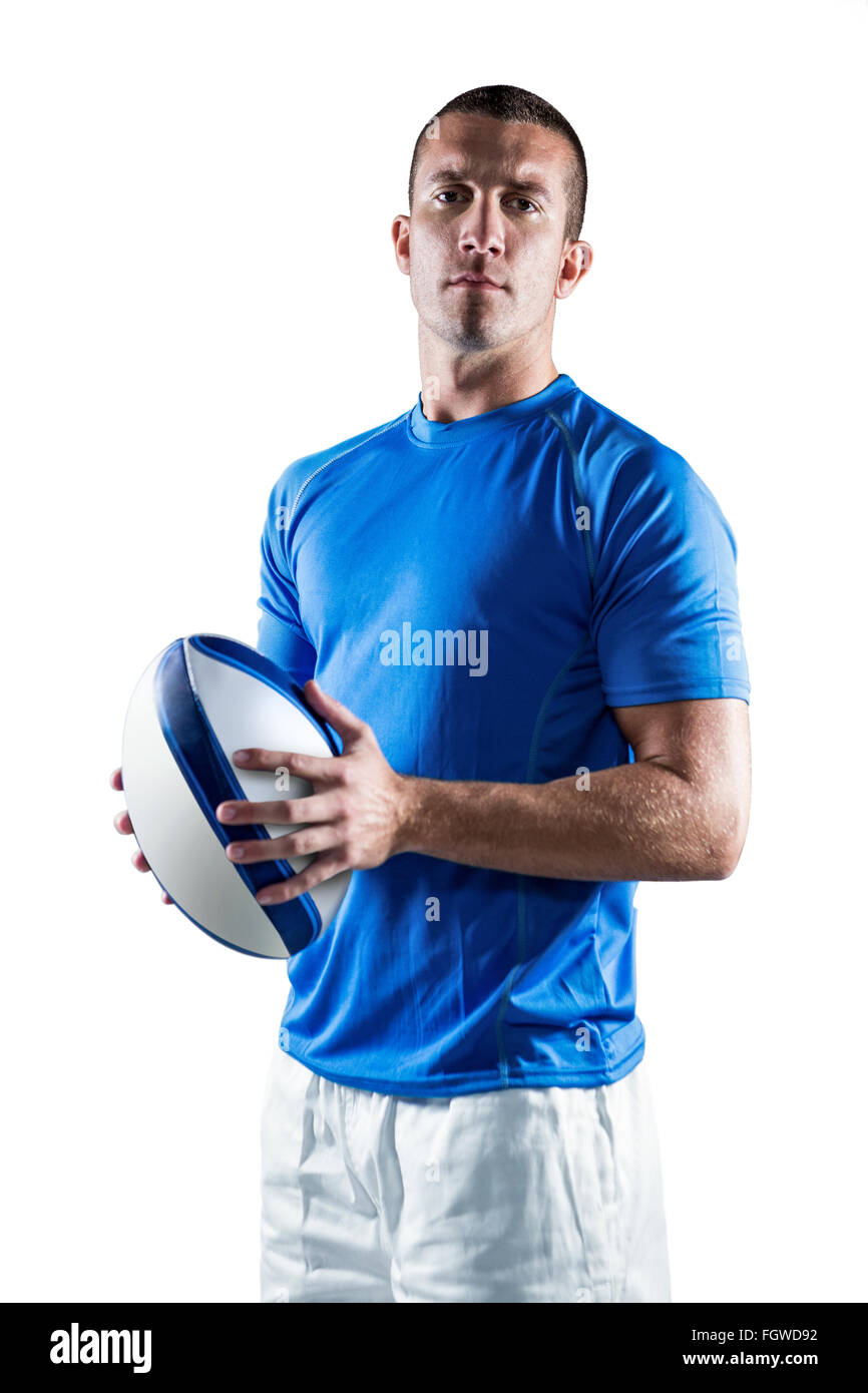 Portrait of confident rugby player holding ball Stock Photo - Alamy