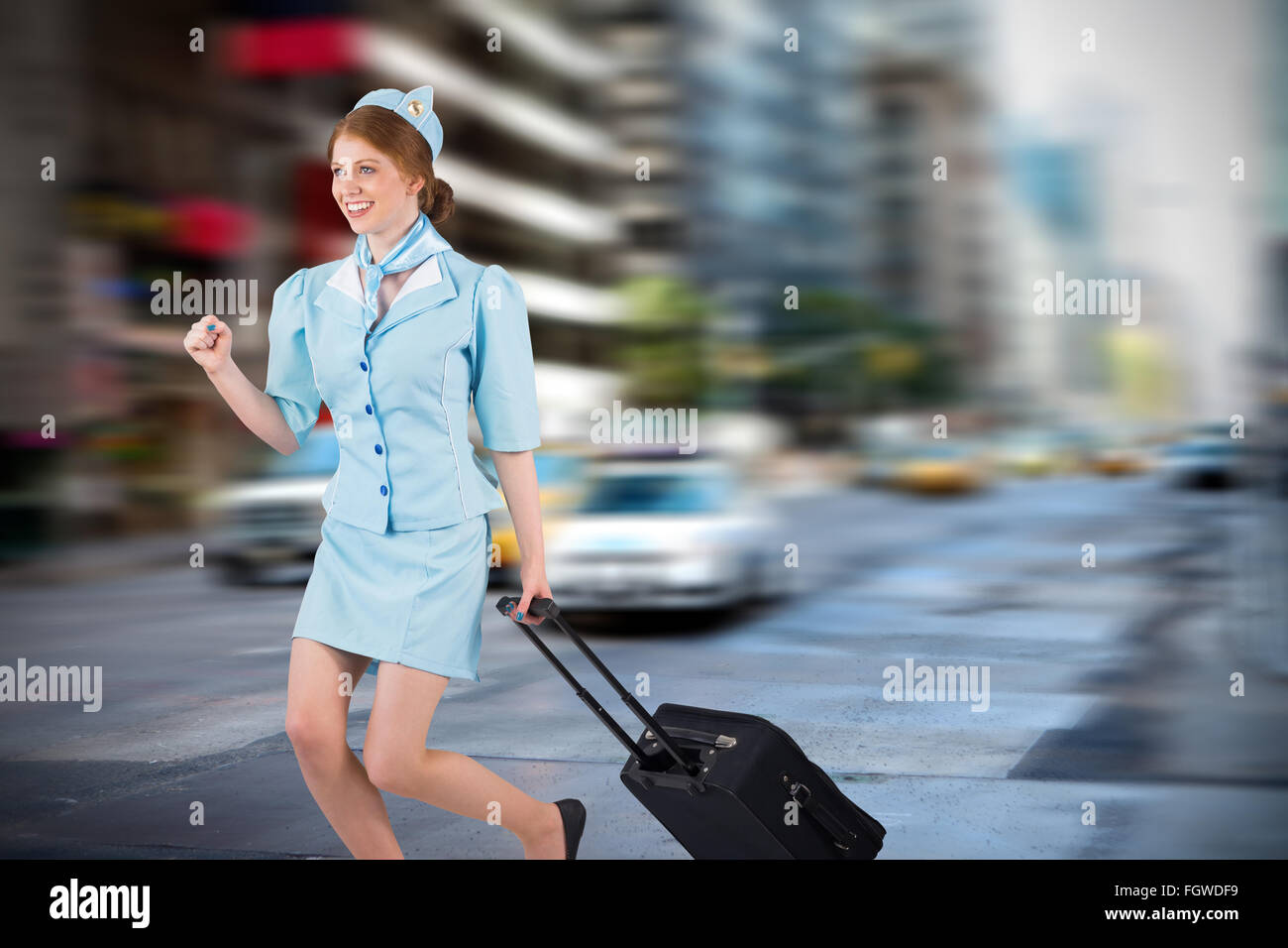 Composite image of pretty air hostess pulling suitcase Stock Photo - Alamy
