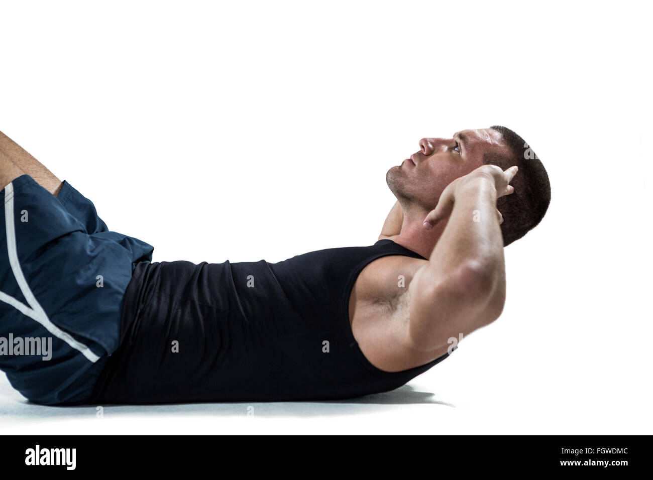 Determined athlete doing crunches Stock Photo - Alamy