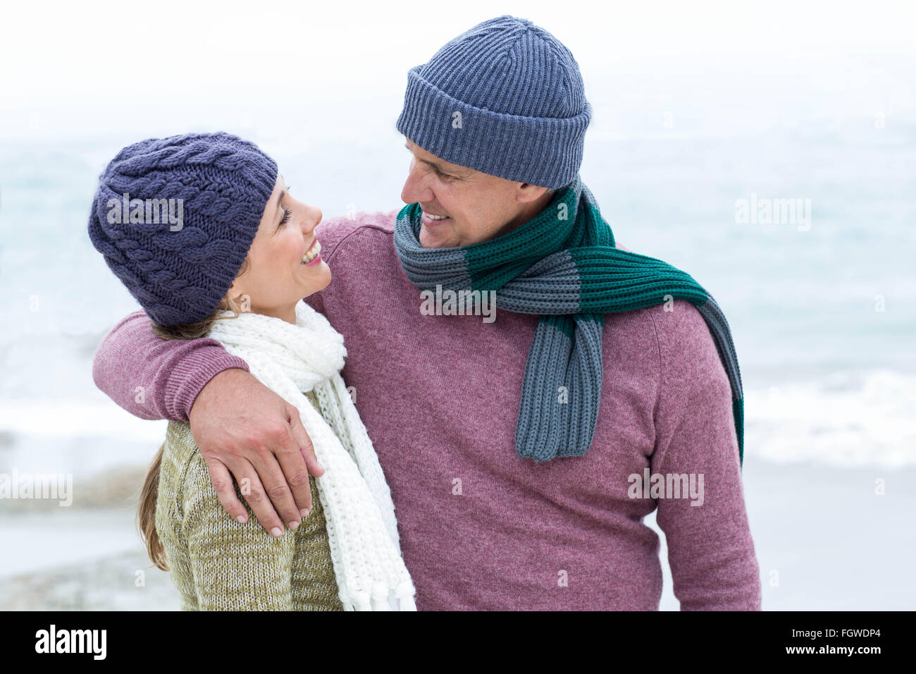 Smiling happy couple hugging each other Stock Photo - Alamy