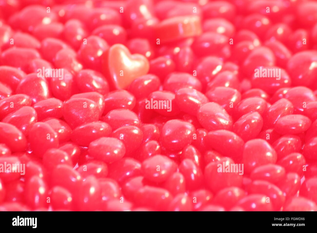 Heart shaped red candies filling the frame Stock Photo - Alamy