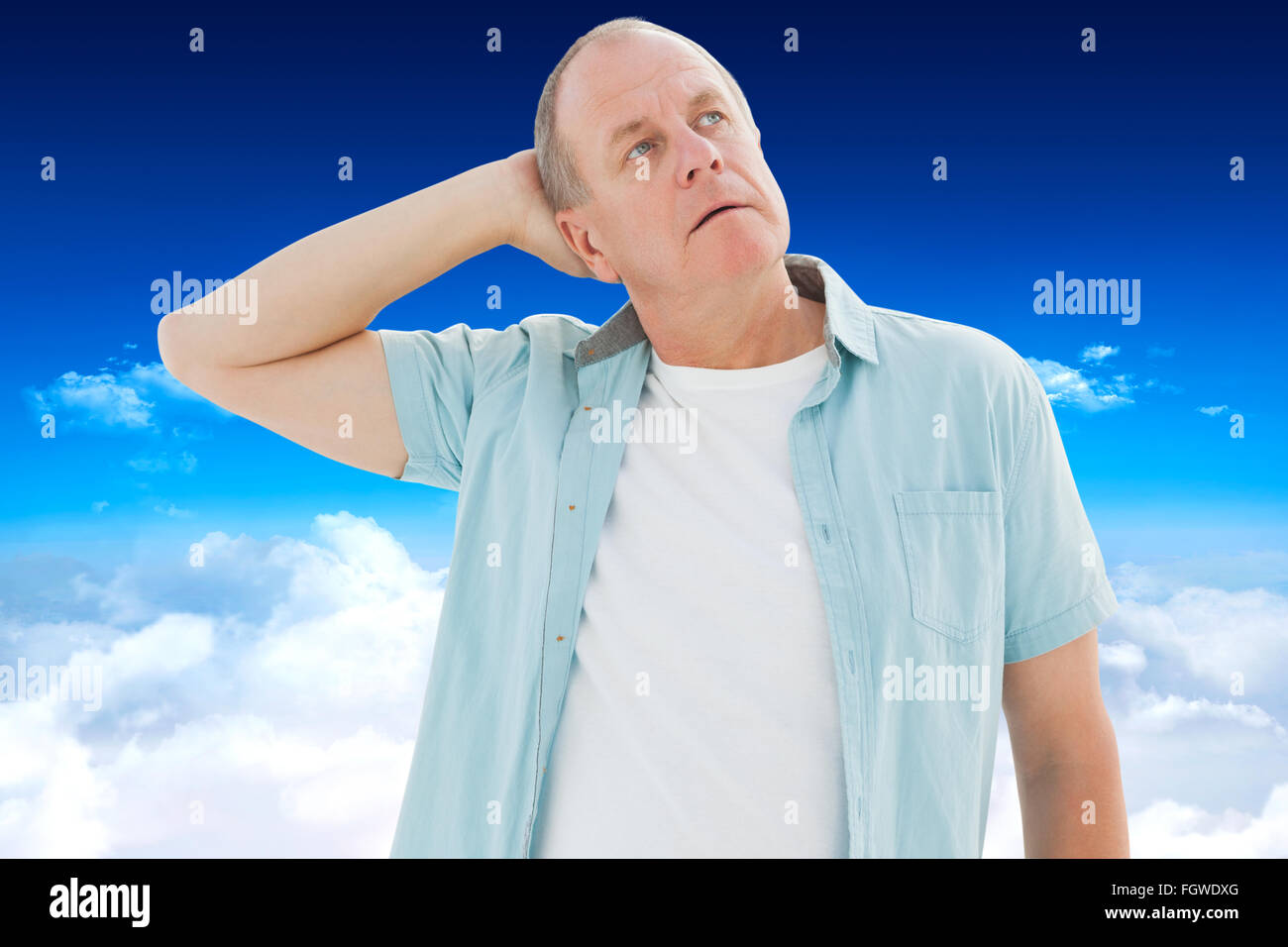 Composite image of thoughtful older man looking up Stock Photo - Alamy