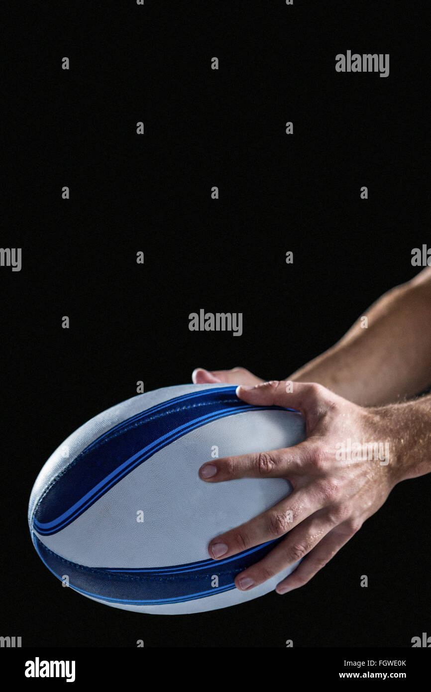 Close-up of of sports player holding ball Stock Photo - Alamy