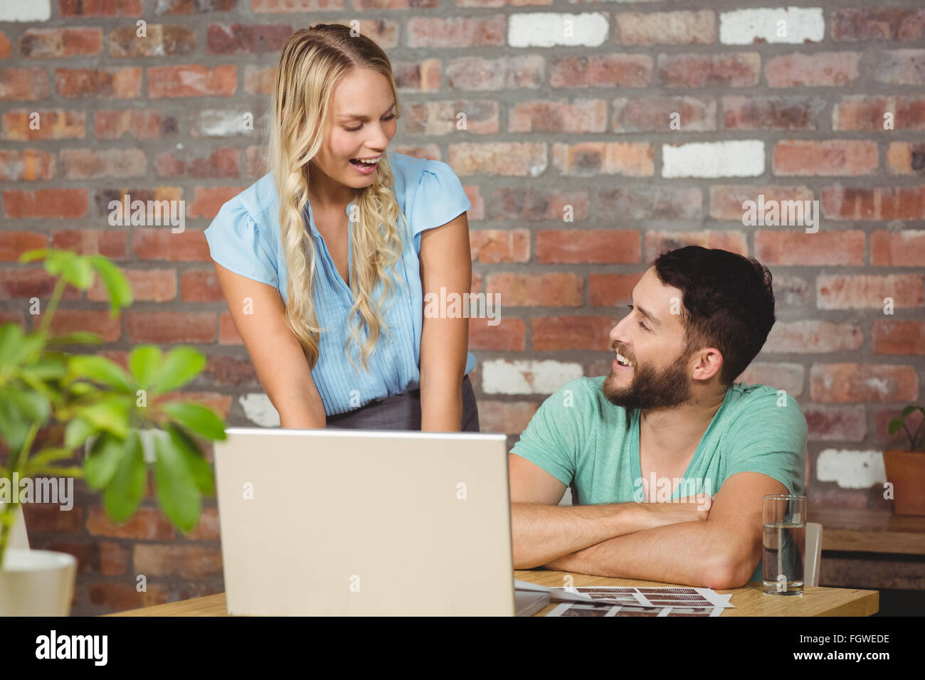 Business people laughing while working Stock Photo - Alamy