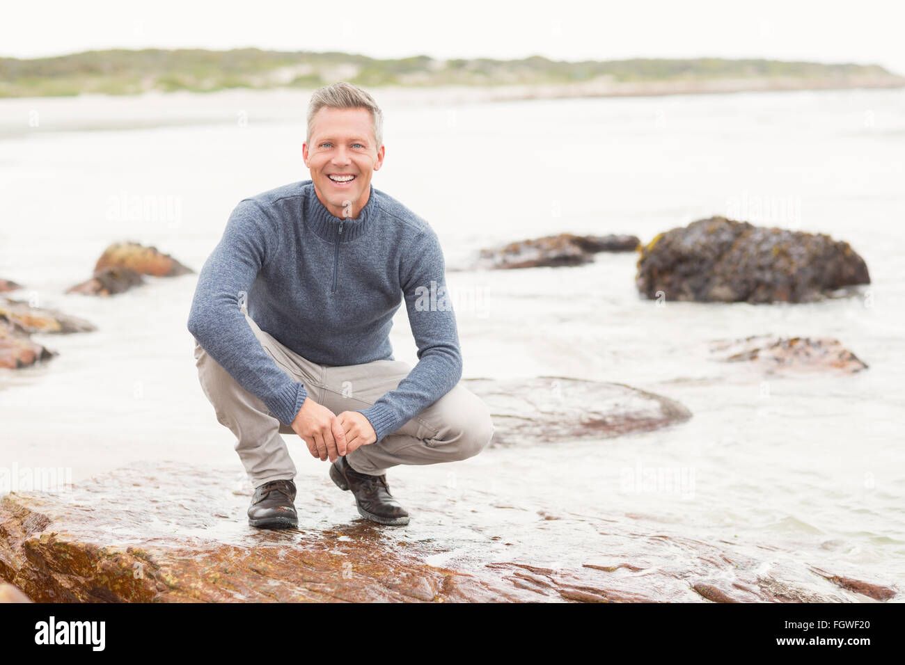 Man crouched down hi-res stock photography and images - Alamy