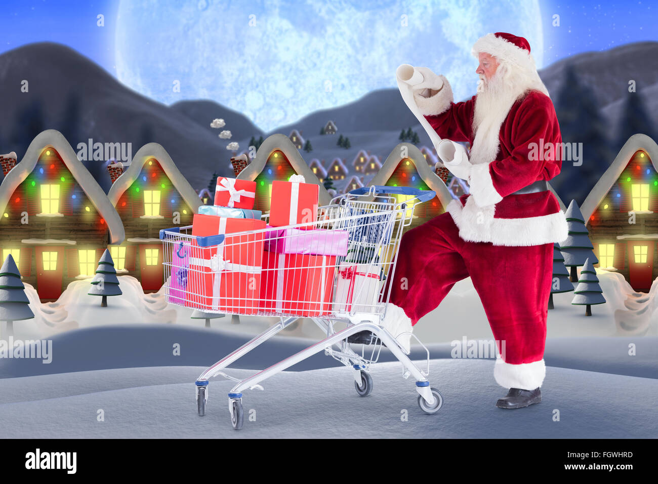 Composite image of santa delivering gifts from cart Stock Photo - Alamy