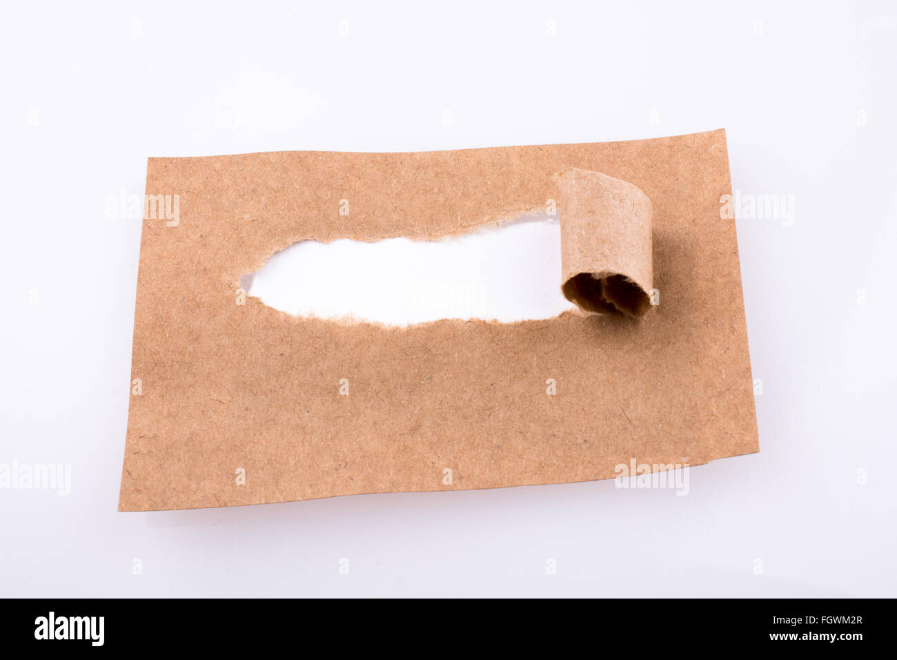 Piece of blank brown torn notepaper on a white background Stock Photo ...