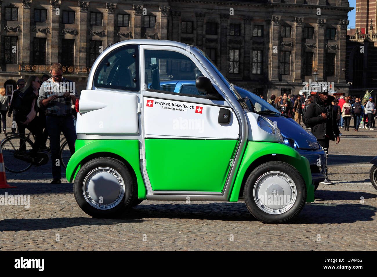 Electric car outside the Royal Palace, Dam Square, Amsterdam ...