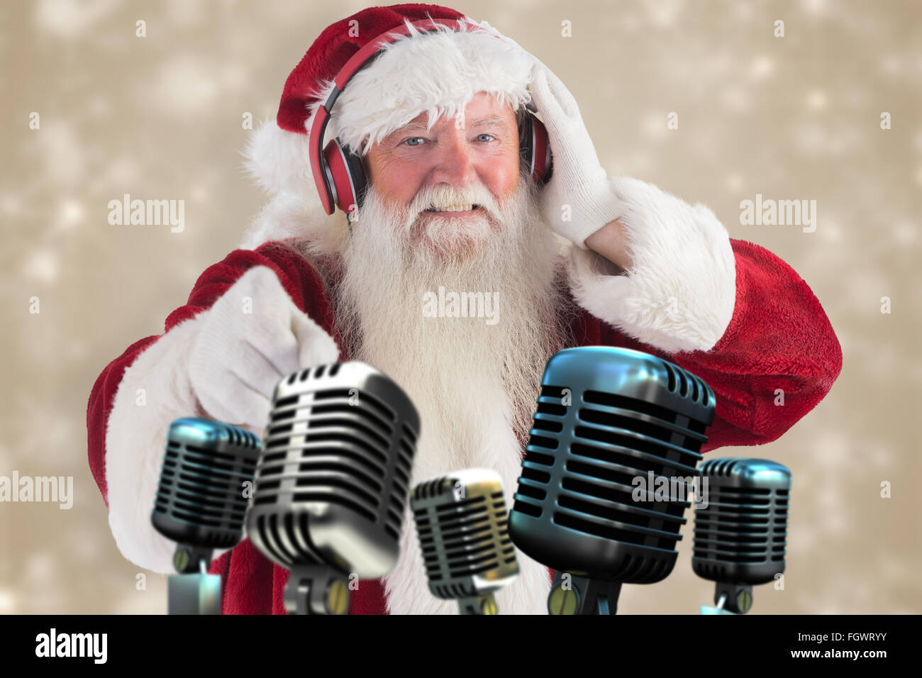 Composite image of santa is listening some music Stock Photo - Alamy