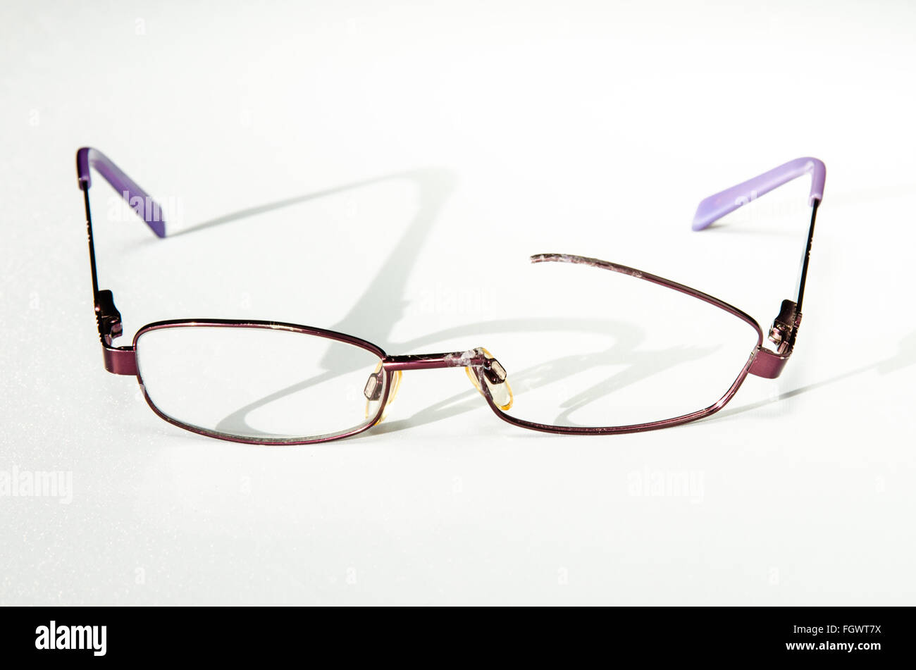 broken eyeglasses detail image isolated Stock Photo - Alamy