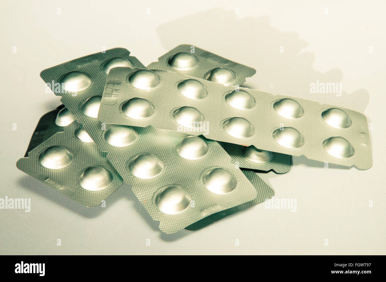 silver set of pills isolated on white image Stock Photo - Alamy