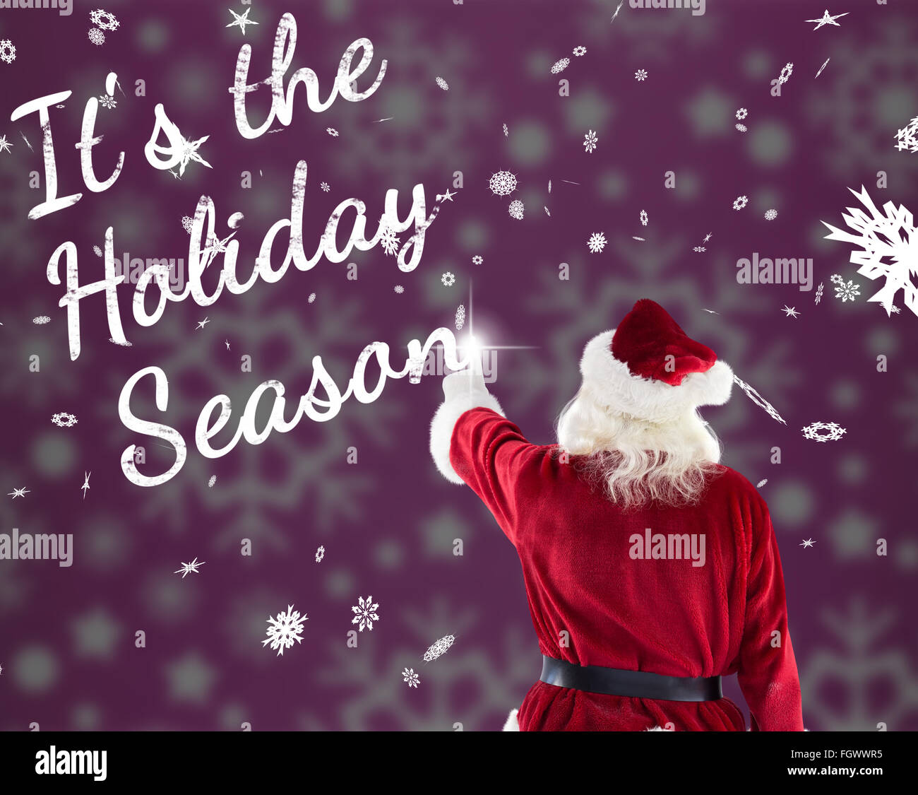 Composite image of santa claus points at something Stock Photo - Alamy