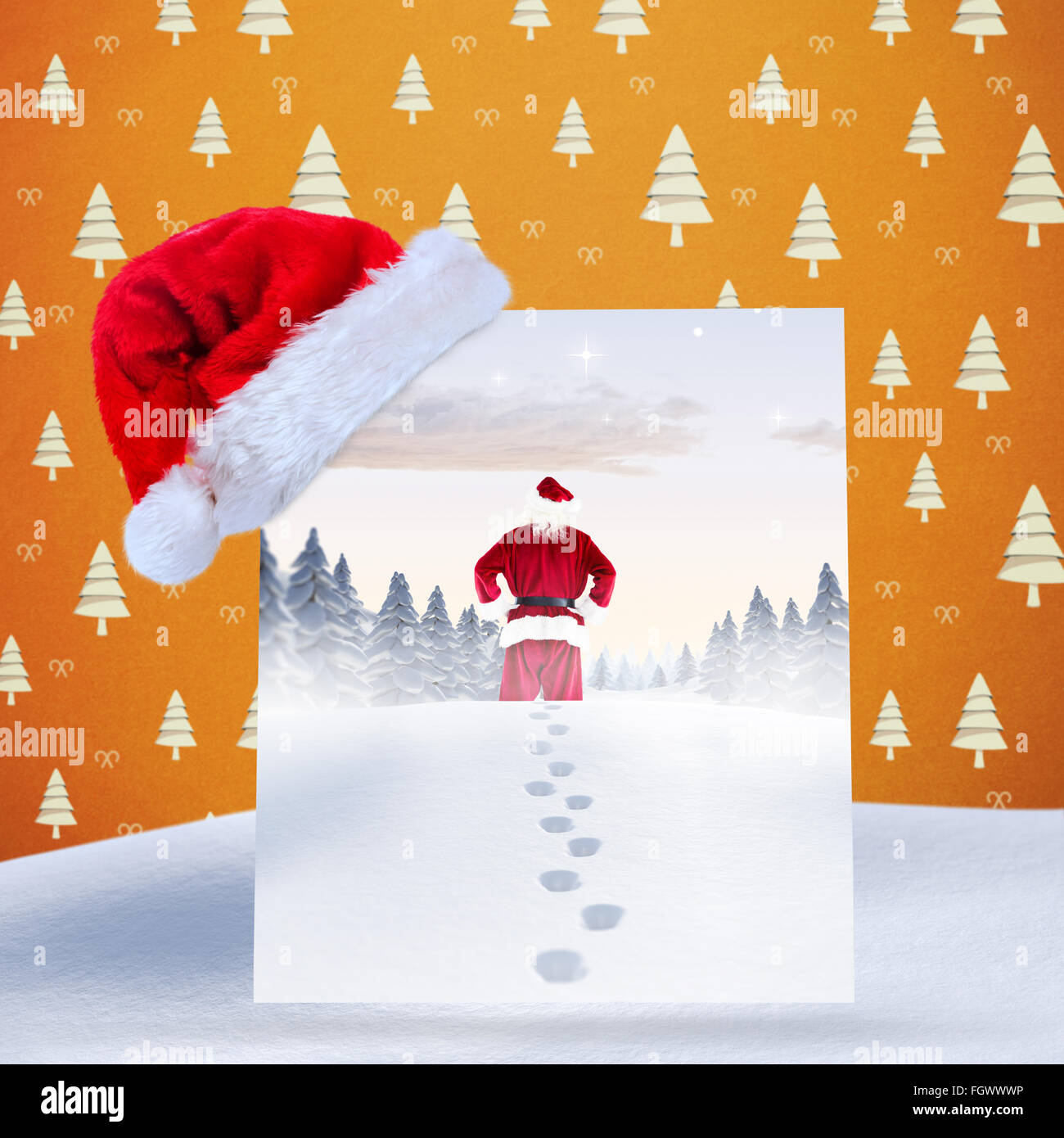 Composite image of santa delivery presents to village Stock Photo - Alamy