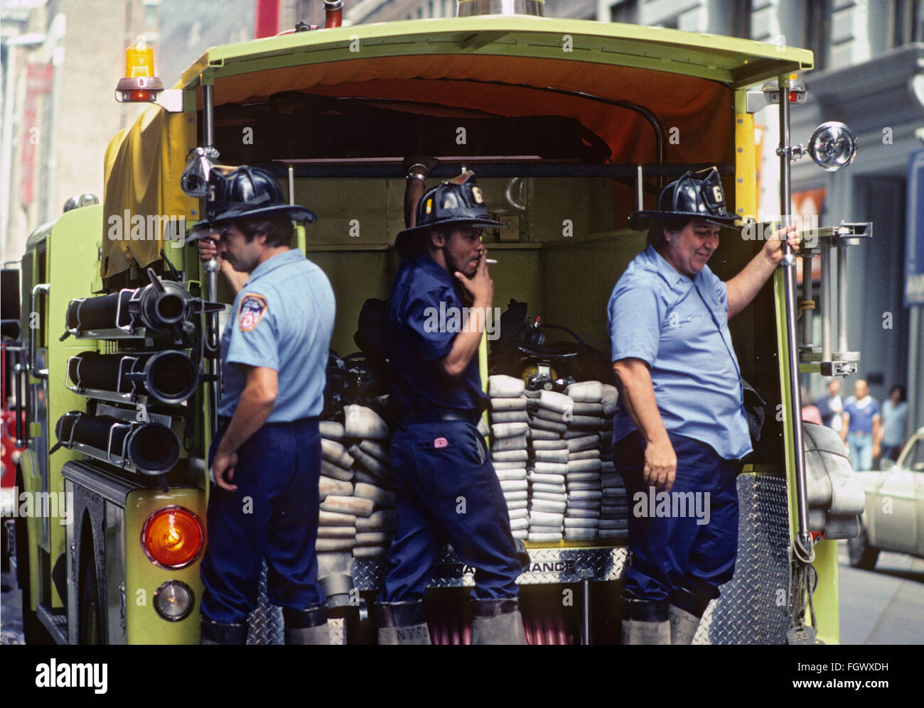 New York firemen on the back of a fire truck, 1981 Stock Photo - Alamy