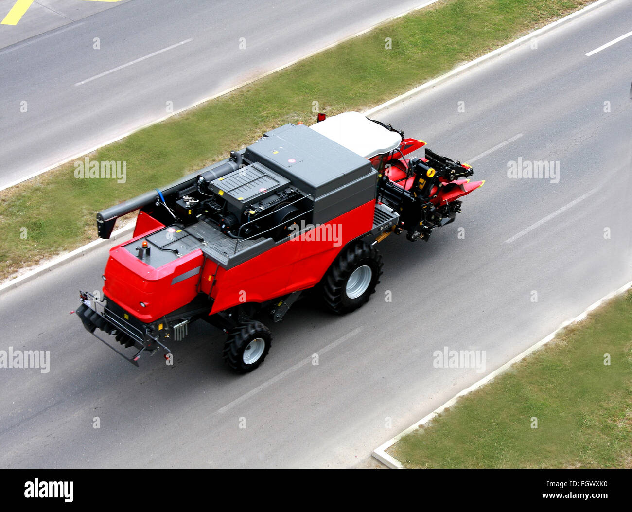 Big vehicle (combine) on the road Stock Photo - Alamy