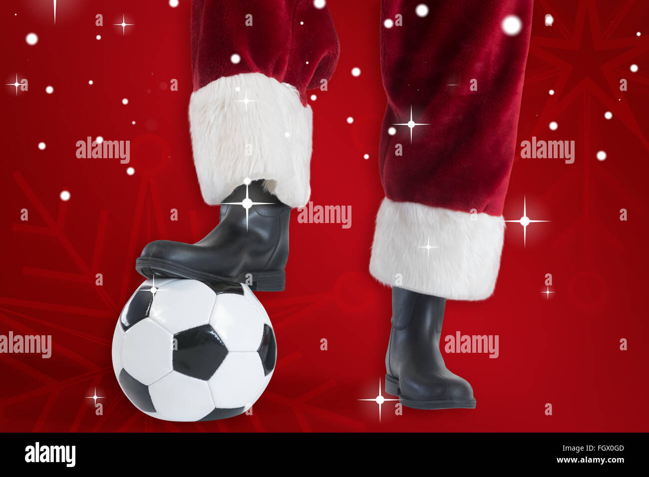 Composite image of santa claus is playing soccer Stock Photo - Alamy