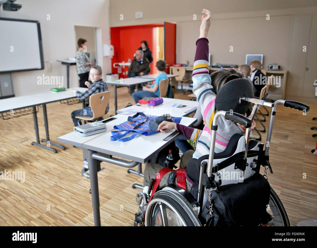 Chemnitz, Germany. 22nd Feb, 2016. A girl in a wheelchair sits in a ...