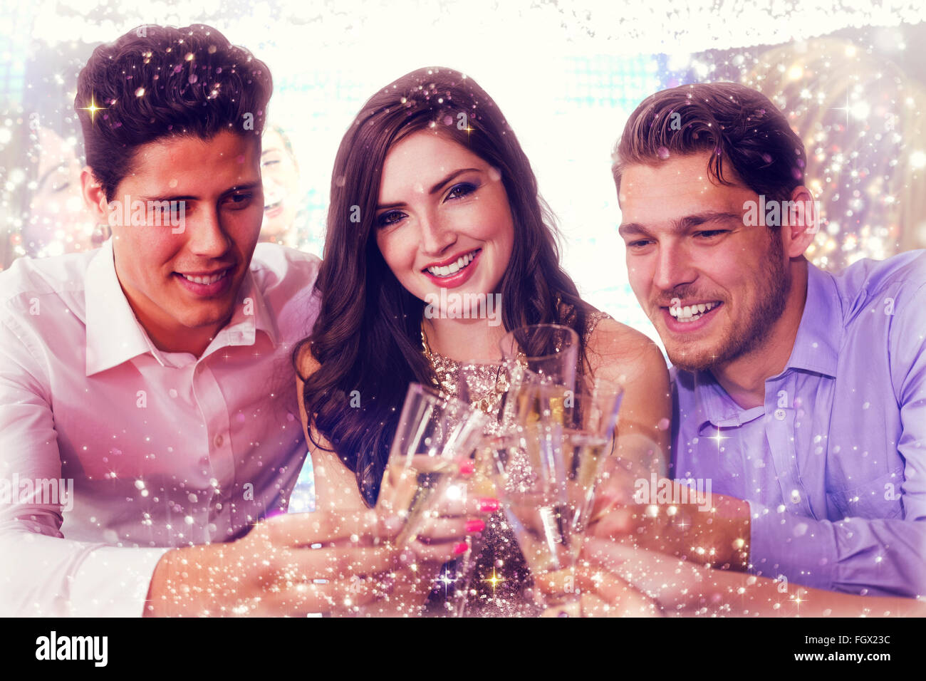 Composite image of friends toasting with champagne Stock Photo - Alamy