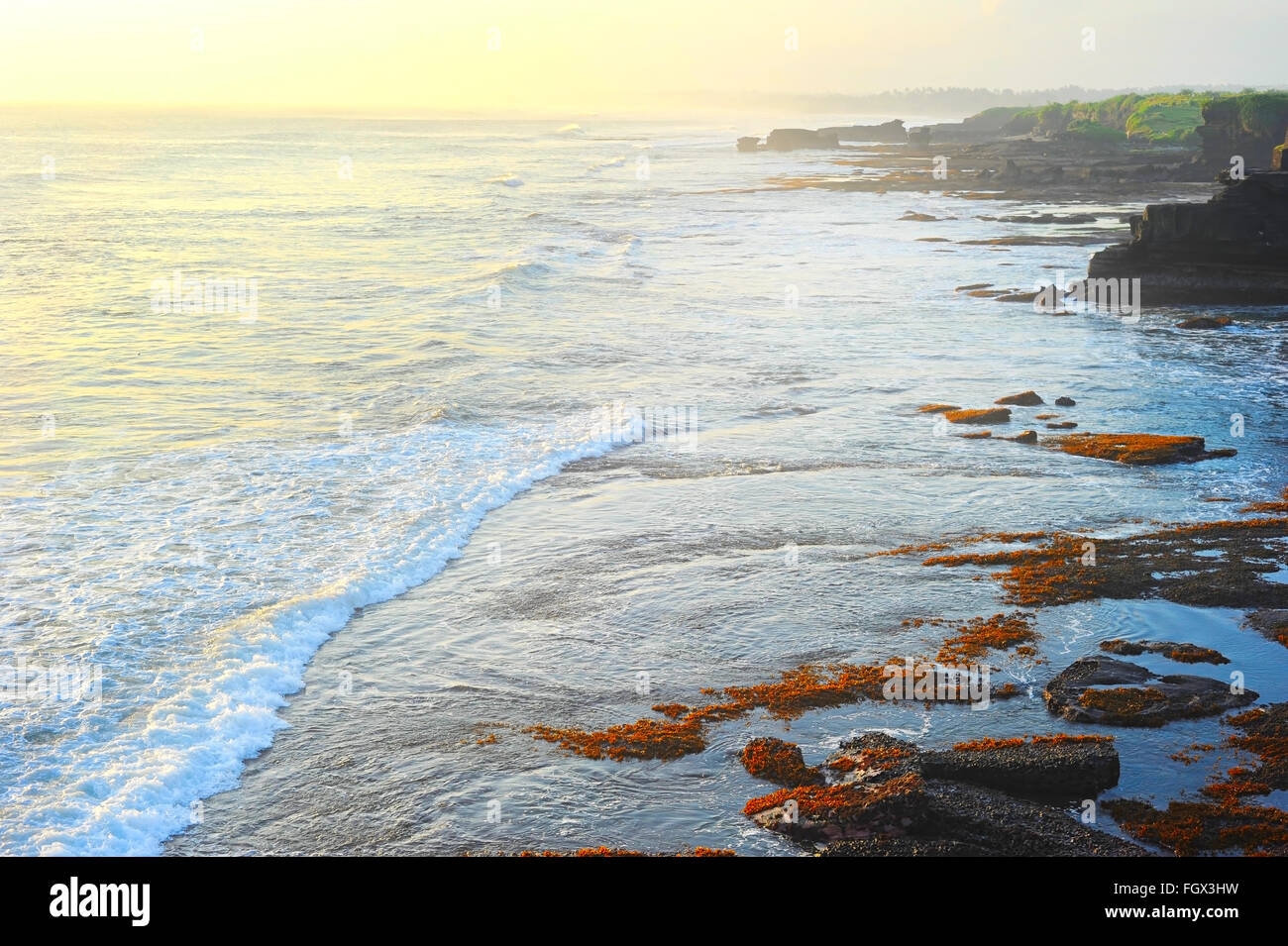 Beautiful rocky coastline of Bali island at sunset Stock Photo - Alamy