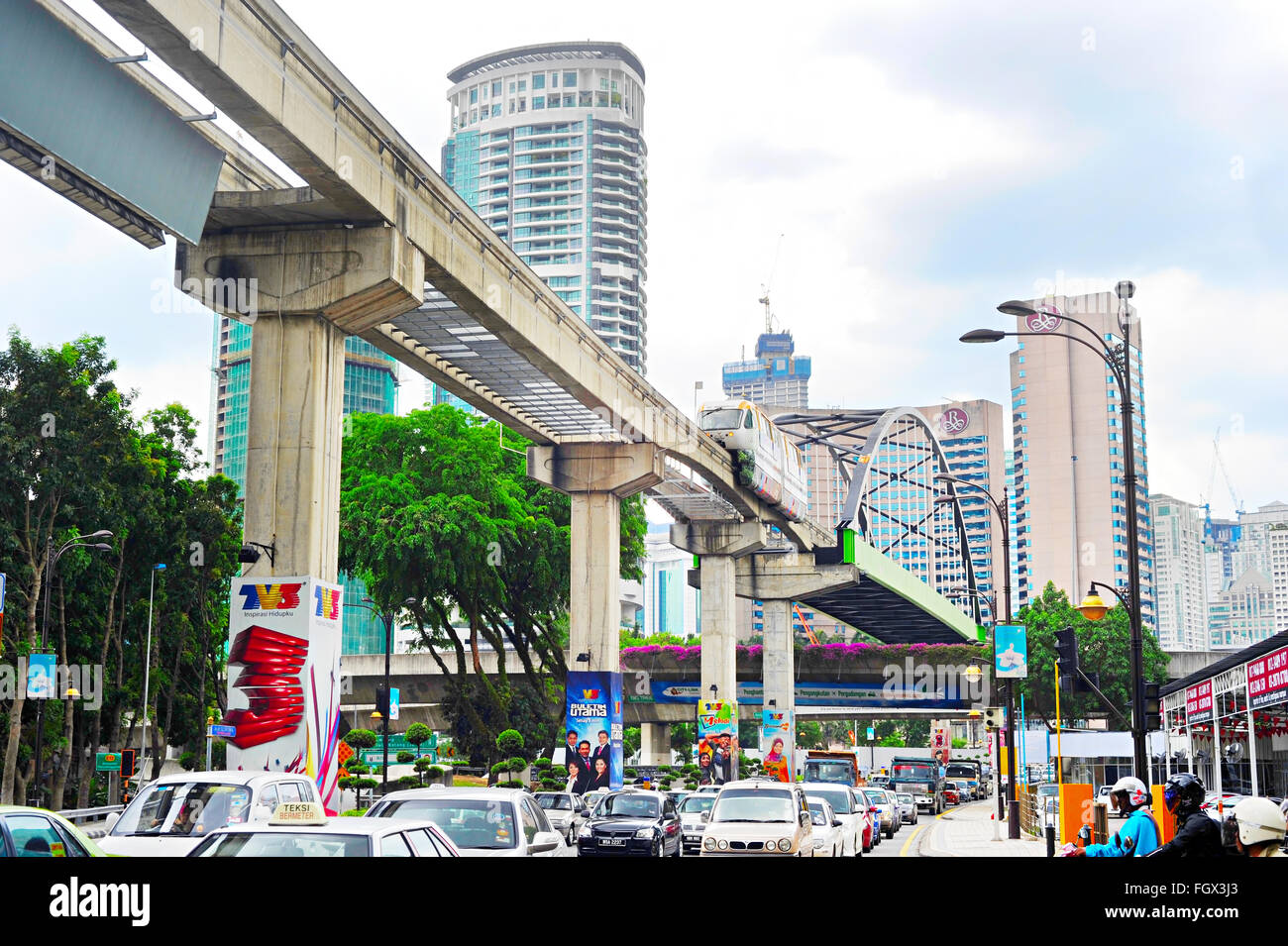 Traffic jam during rush hour and monorail train on elevated rail ...