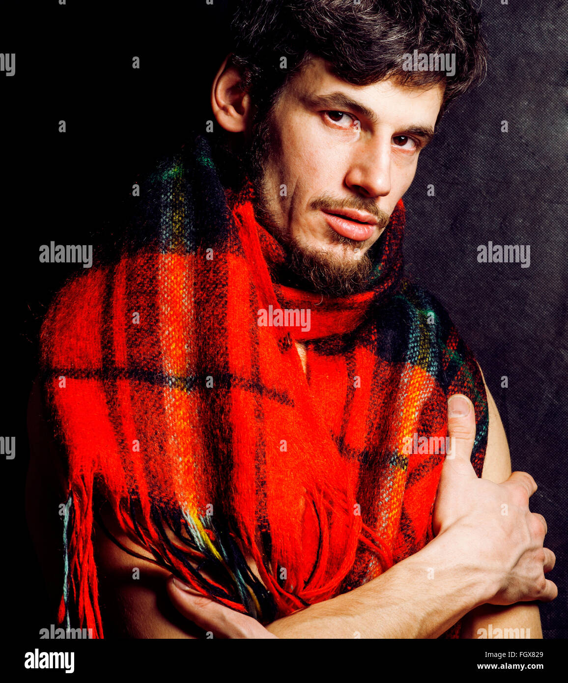 portrait of handsome man warmed up in scarf, smiling closeup dark ...