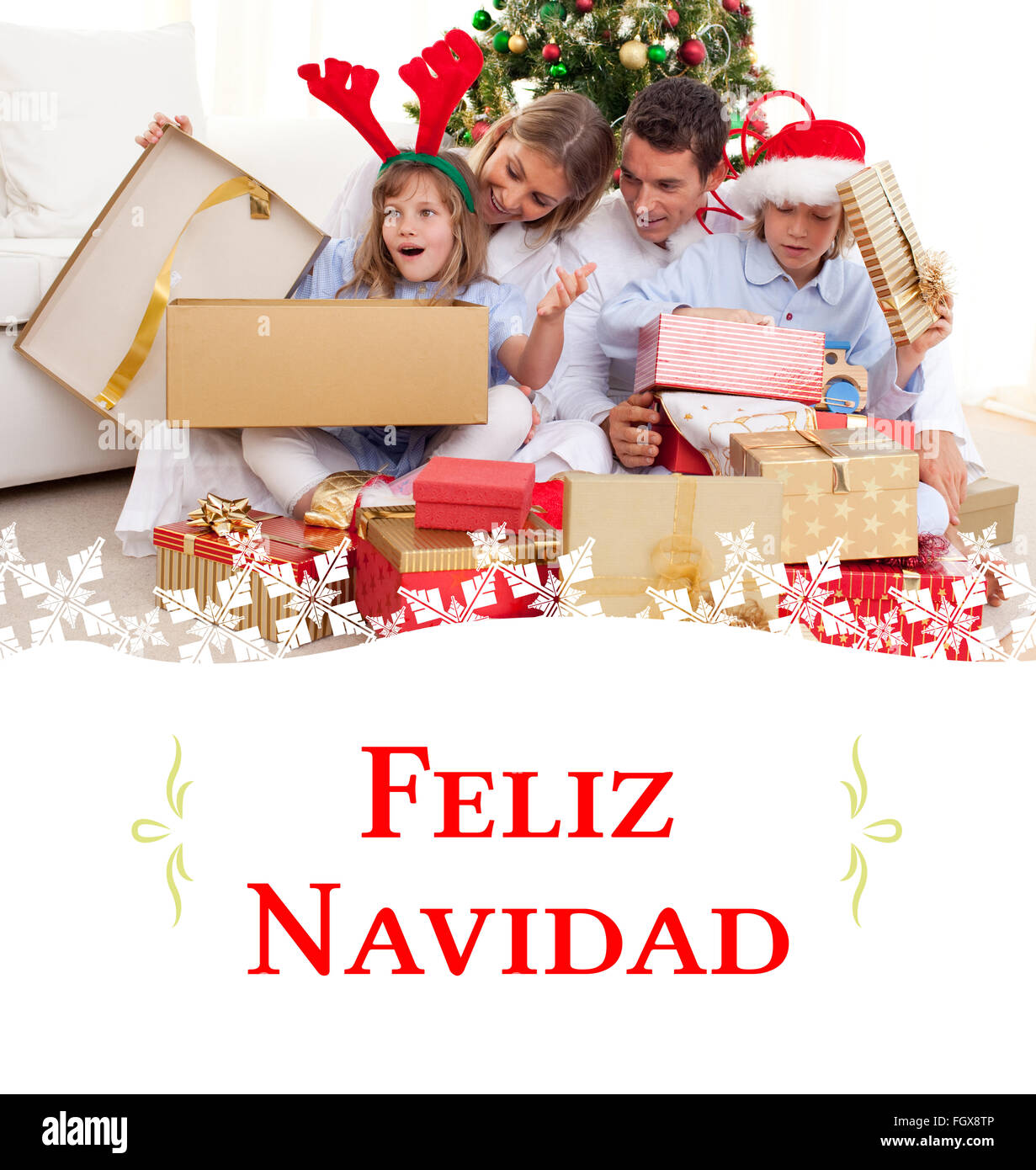 Composite image of portrait of a happy family unpacking christmas ...