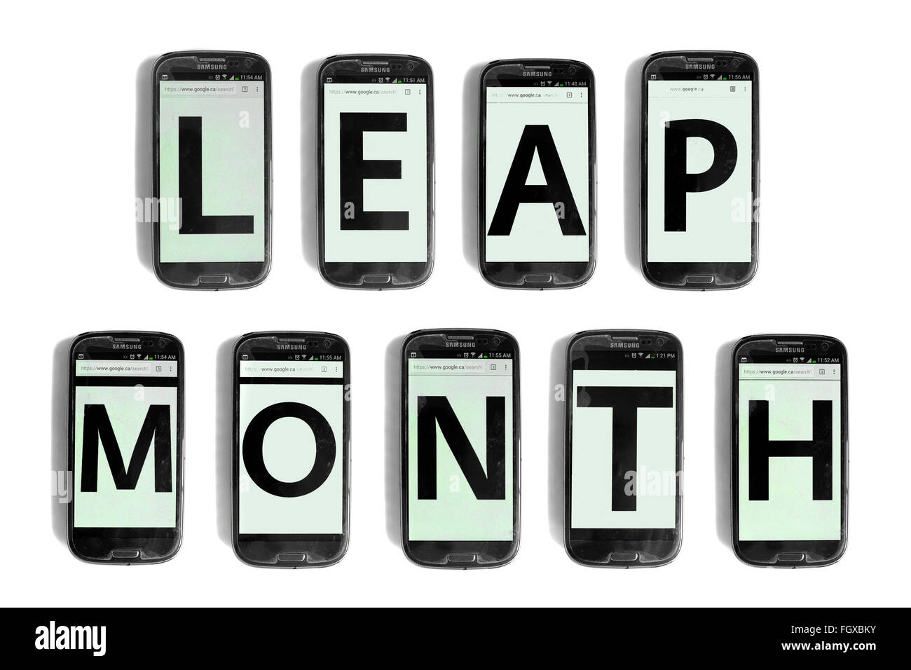 Leap Month written on the screens of smartphones photographed against a ...