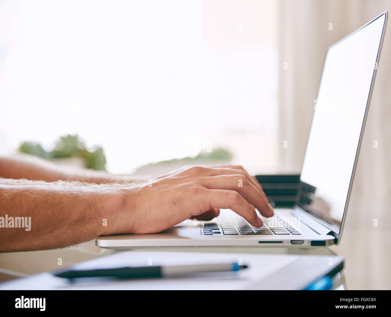 White hands busy typing on a laptop computer Stock Photo - Alamy
