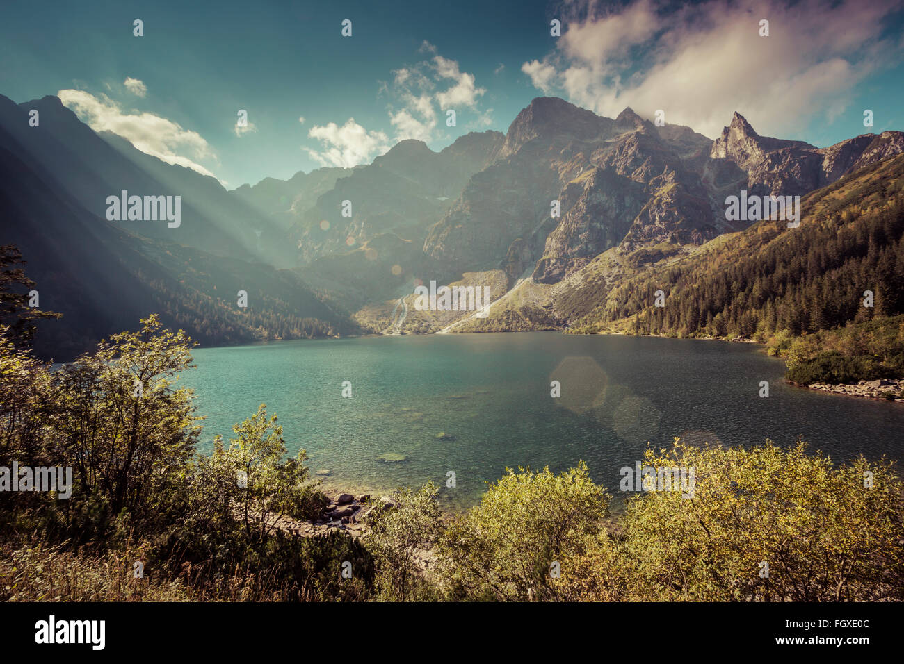 Green water mountain lake Morskie Oko, Tatra Mountains, Poland Stock ...