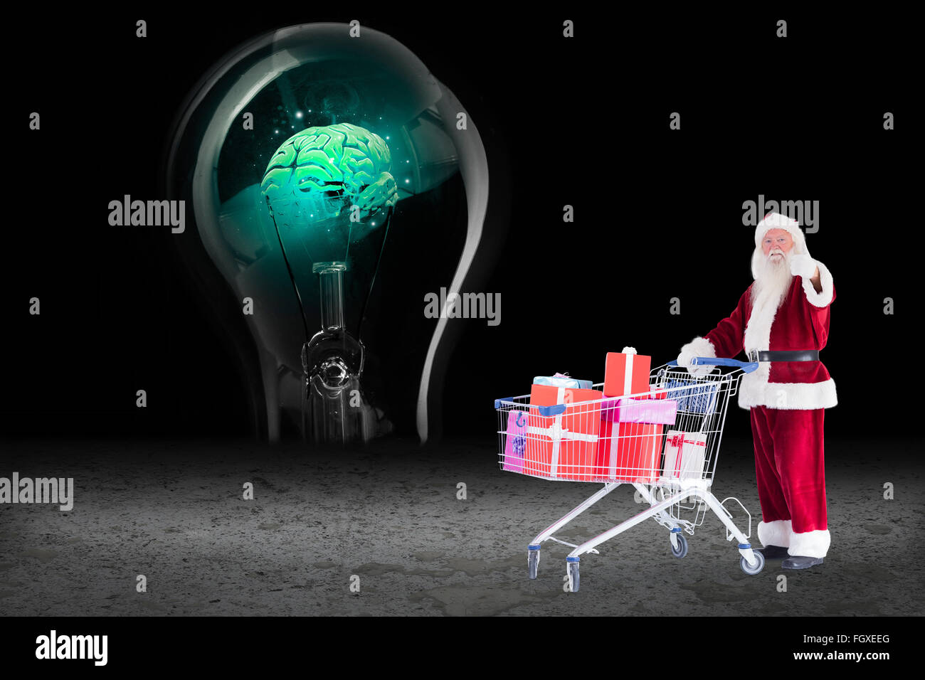 Composite image of santa pushing a shopping cart Stock Photo - Alamy