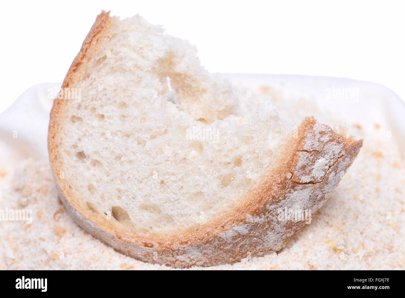 Homemade breadcrumb with slice of bread isolated on white background ...