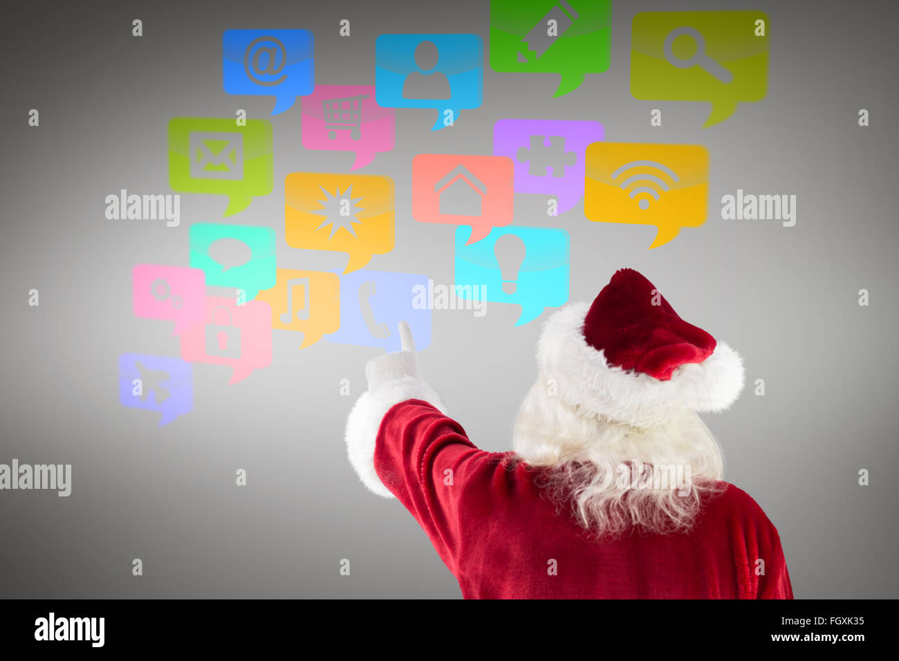 Composite image of santa claus points at something Stock Photo - Alamy