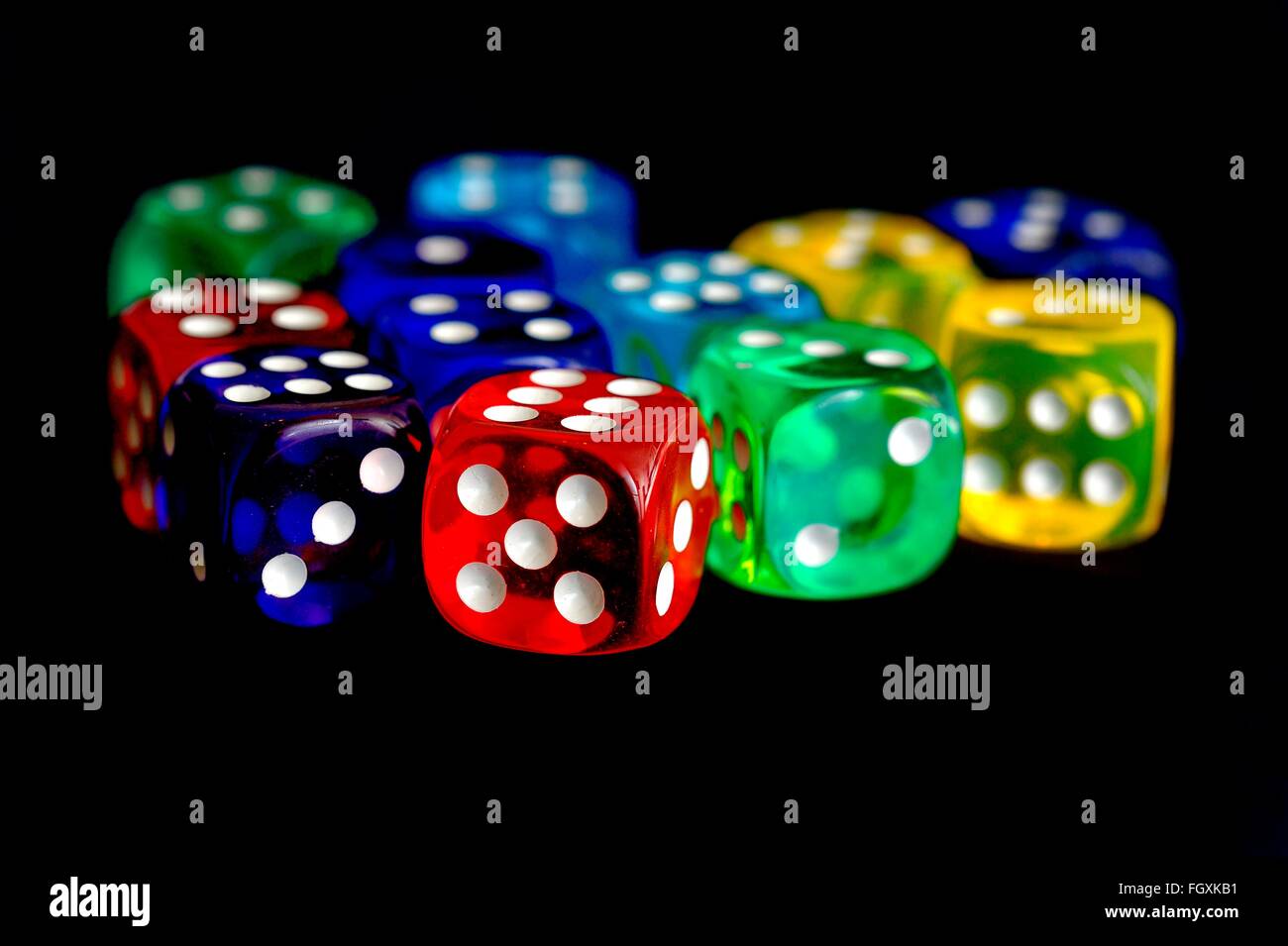Pile of assorted colored coloured dice hi-res stock photography and ...